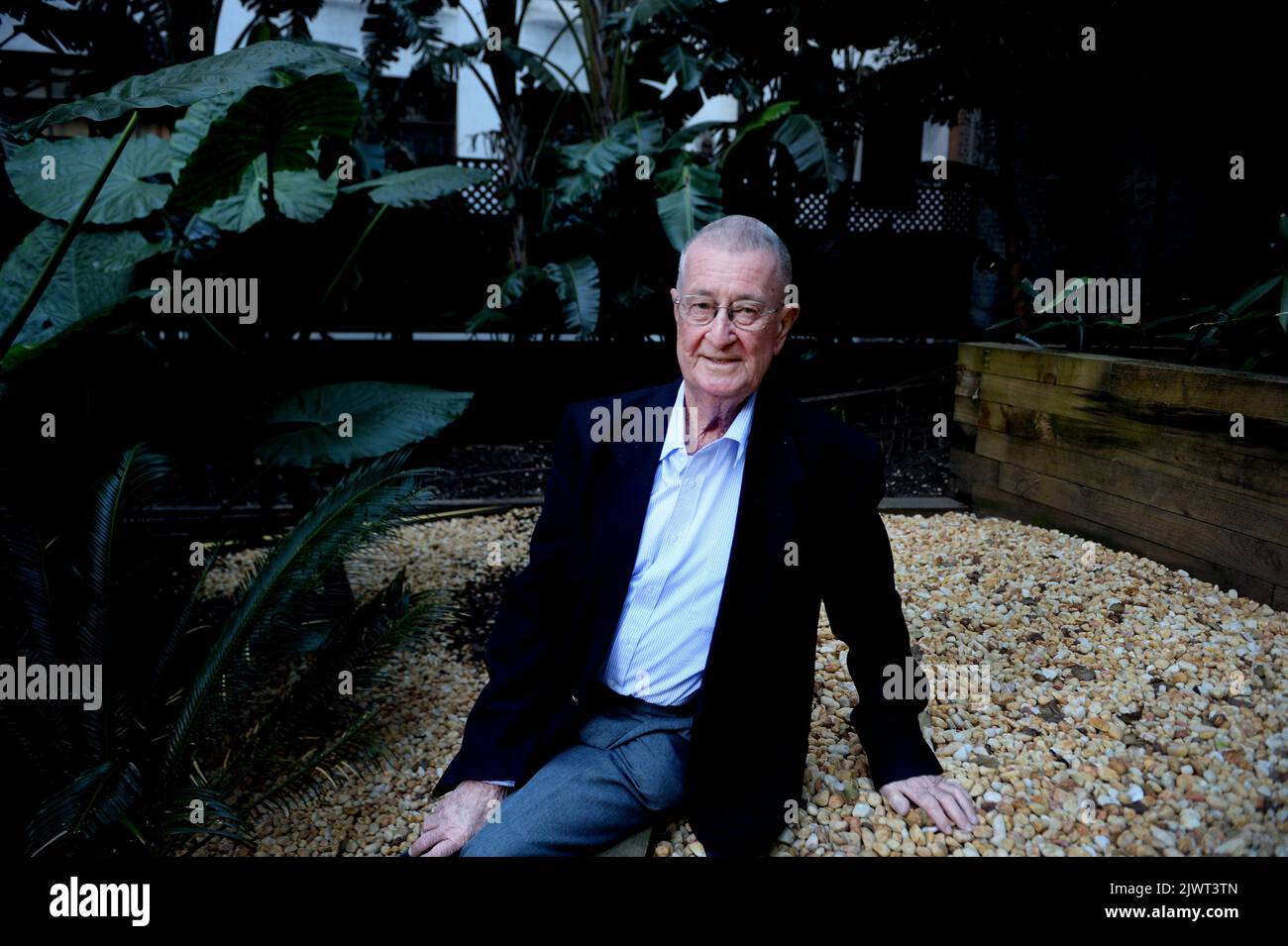 Australian author Denis Ryan poses for photographs in Sydney, Wednesday ...