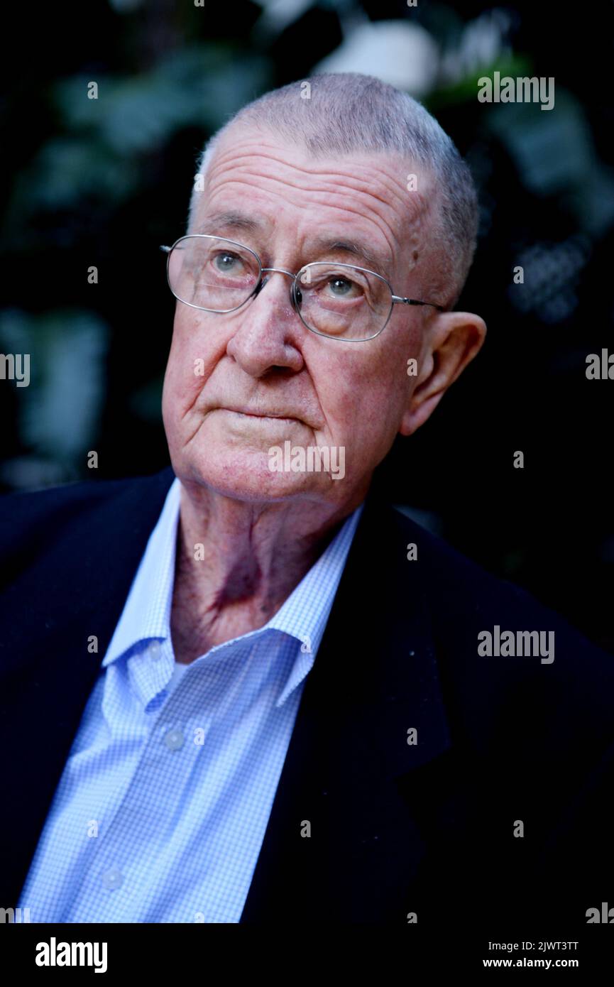 Australian author Denis Ryan poses for photographs in Sydney, Wednesday ...