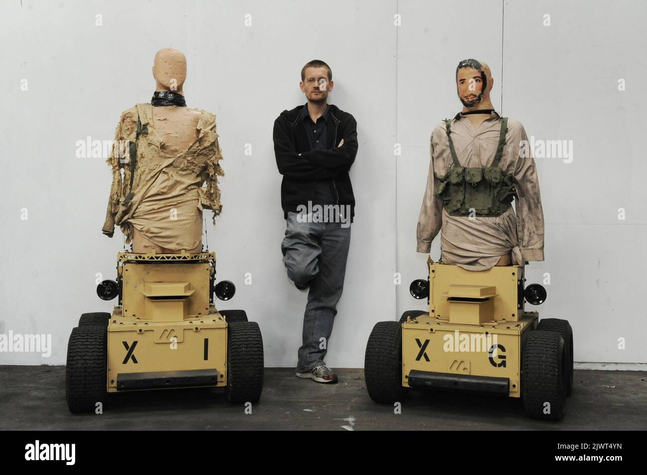 Marathon Targets Director Alex Brooks poses with robotic targets at his ...