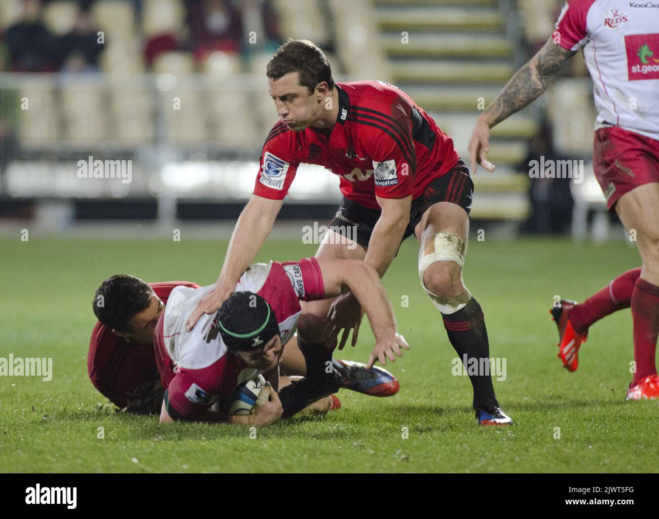 Reds Liam Gill in the tackle of Crusaders in the Super Rugby qualifier ...