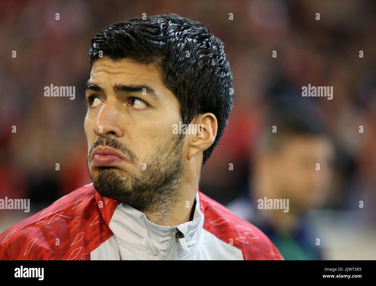 Luis Suarez of Liverpool FC has a look at the packed MCG as he makes ...