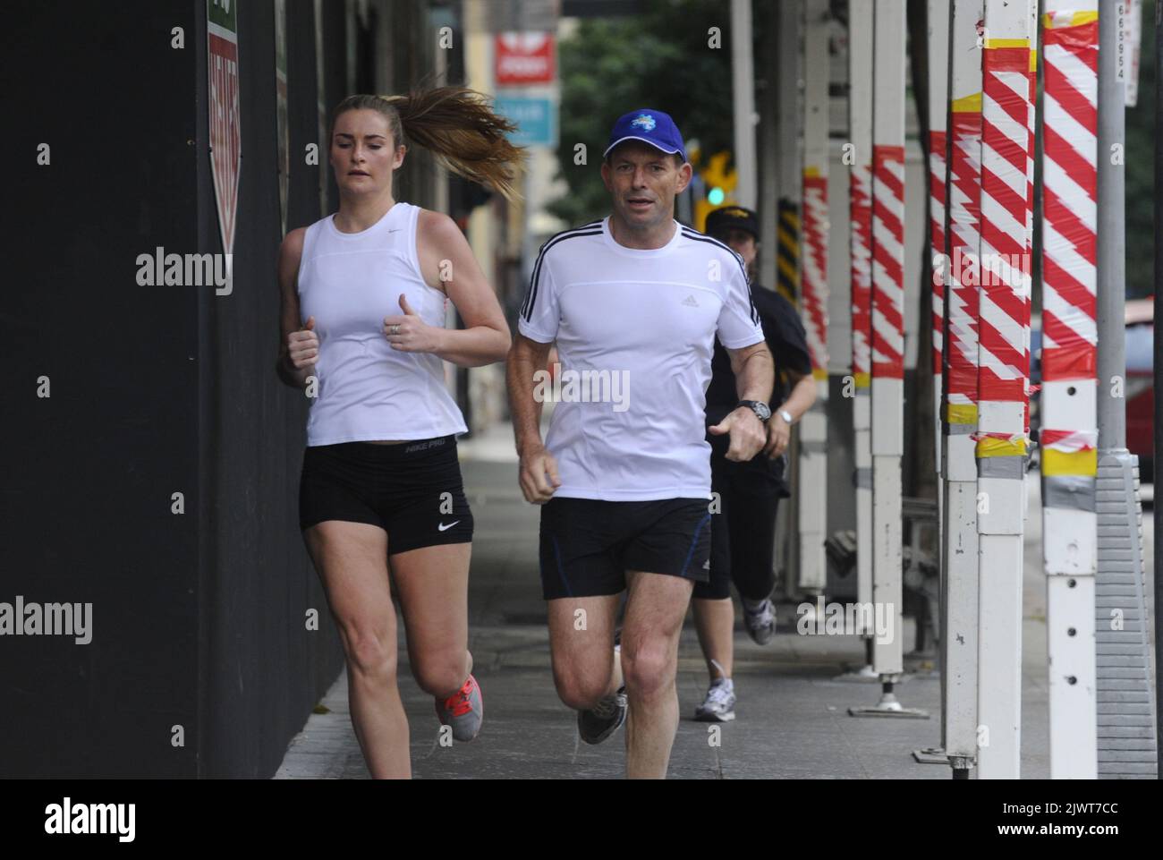 Opposition leader Tony Abbott on his morning run with daughter Bridget ...