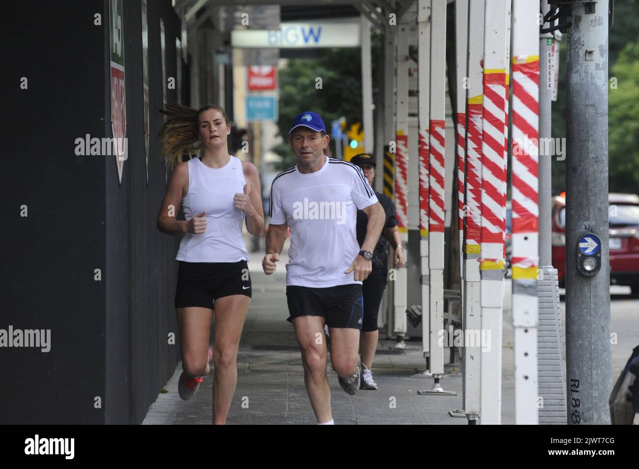Opposition leader Tony Abbott on his morning run with daughter Bridget ...