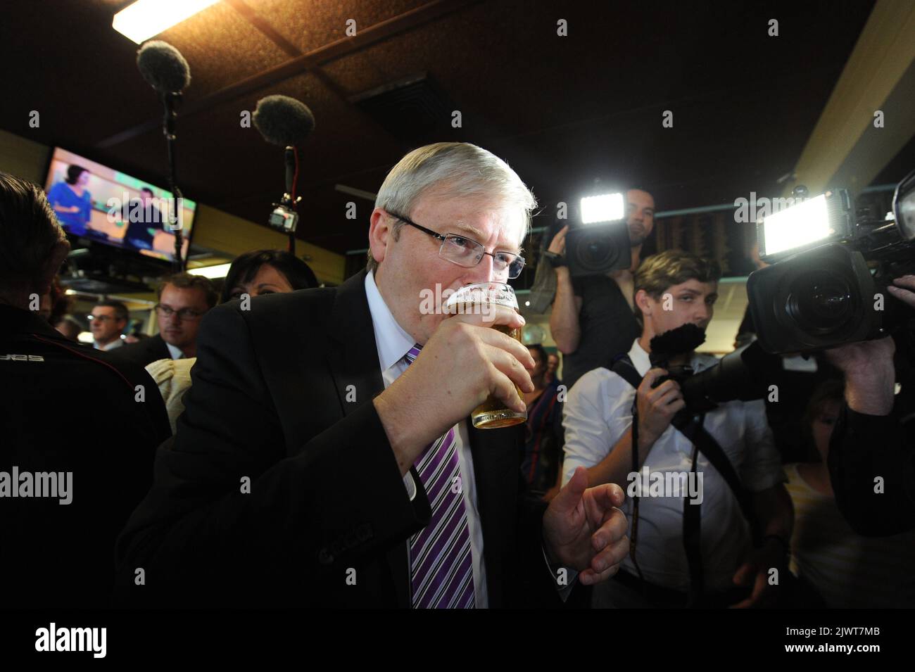 Prime Minister Kevin Rudd drinks a beer as he visits Condong Bowling ...