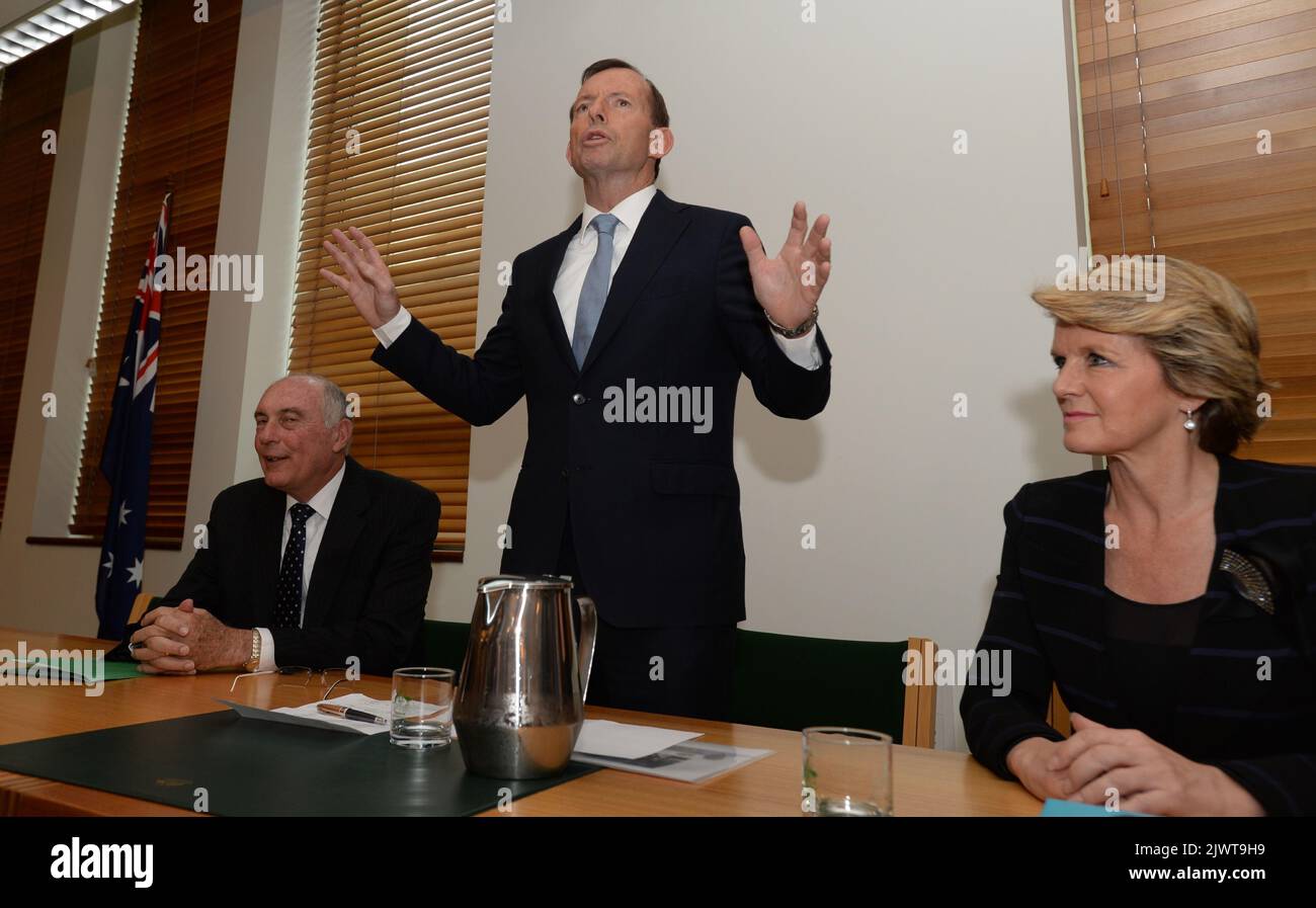 Nationals leader Warren Truss (left) and Julie Bishop listen to Prime ...