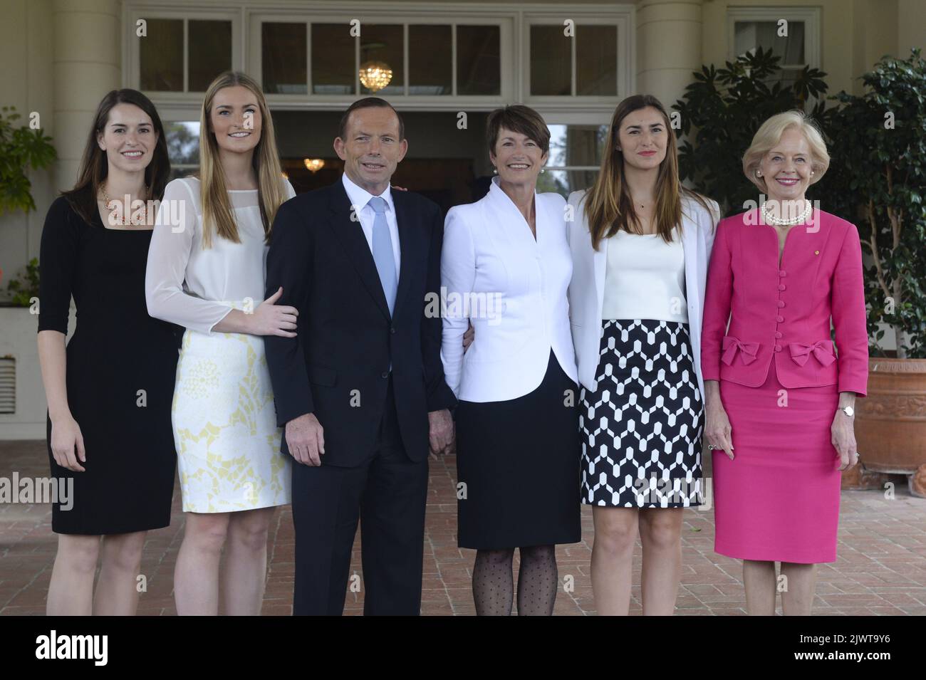 Prime Minister Tony Abbott (centre) poses for photographs with his ...