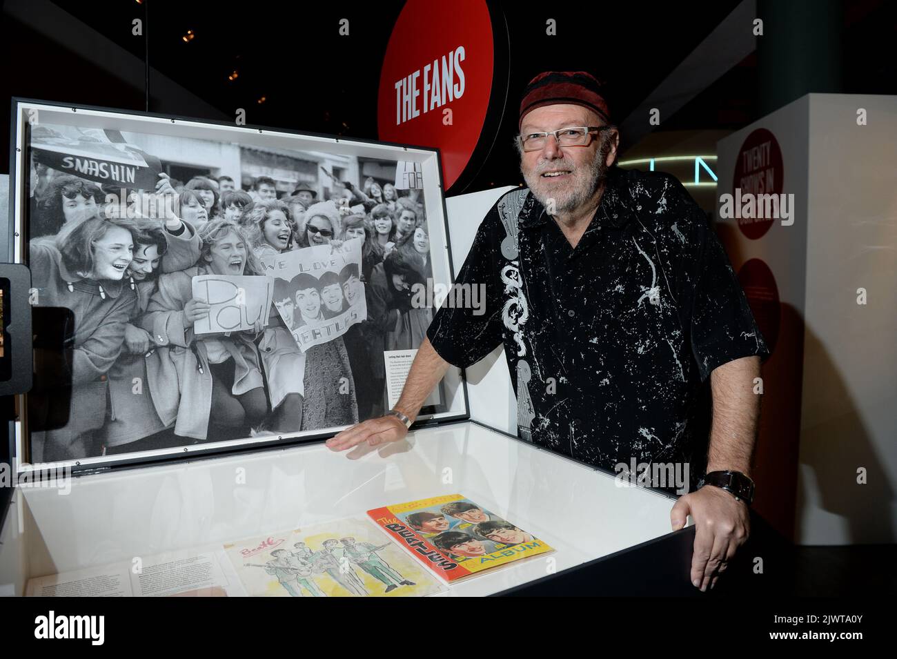 Rock historian Glenn A. Baker poses for a photograph at the opening of ...