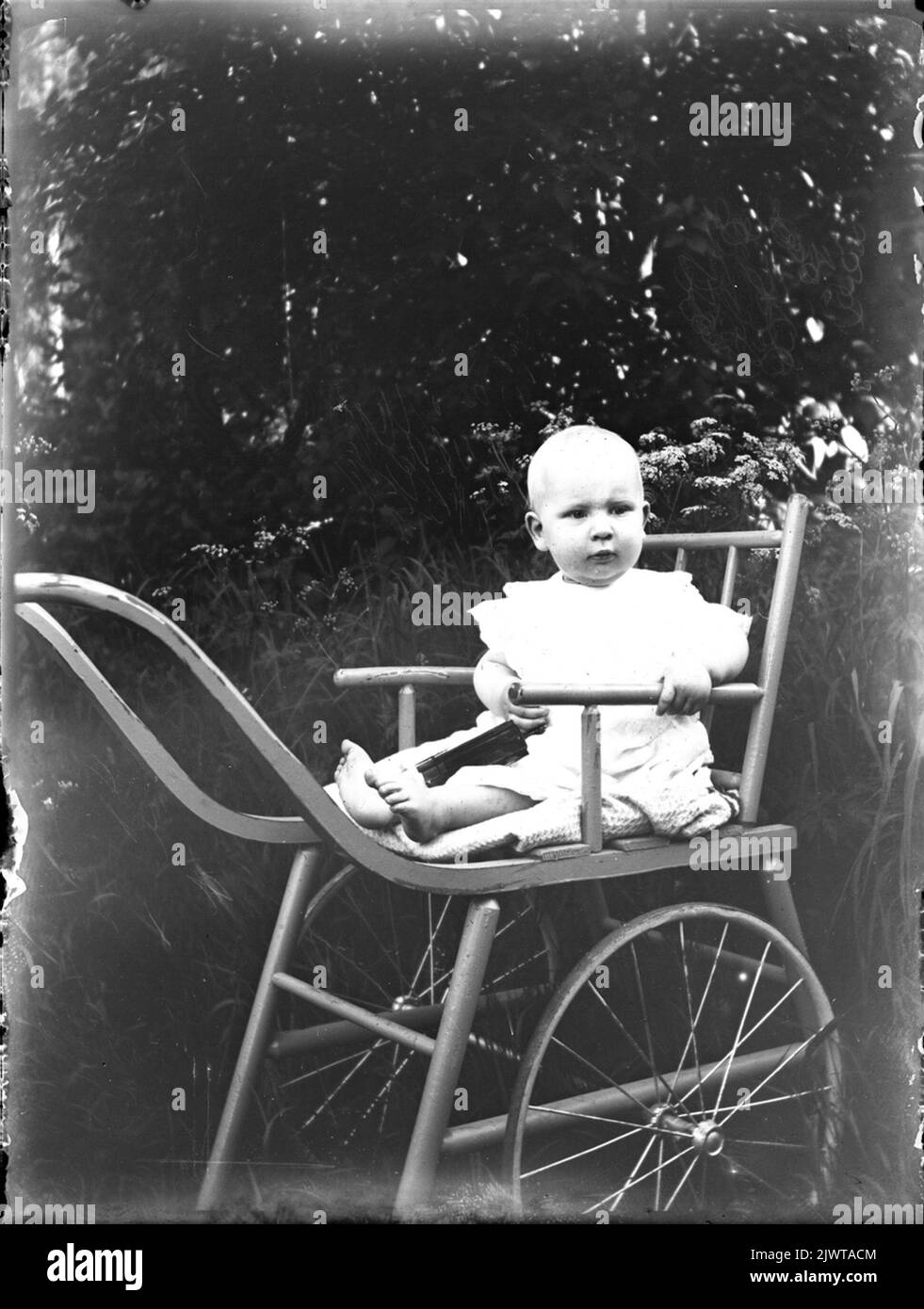 Toddler in "stroller". Litet barn i "sittvagn Stock Photo - Alamy