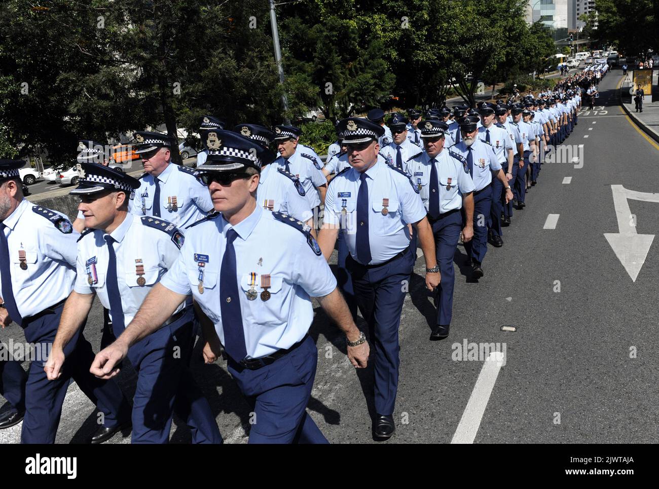 Members of the Queensland Police march to commemorate National Police ...
