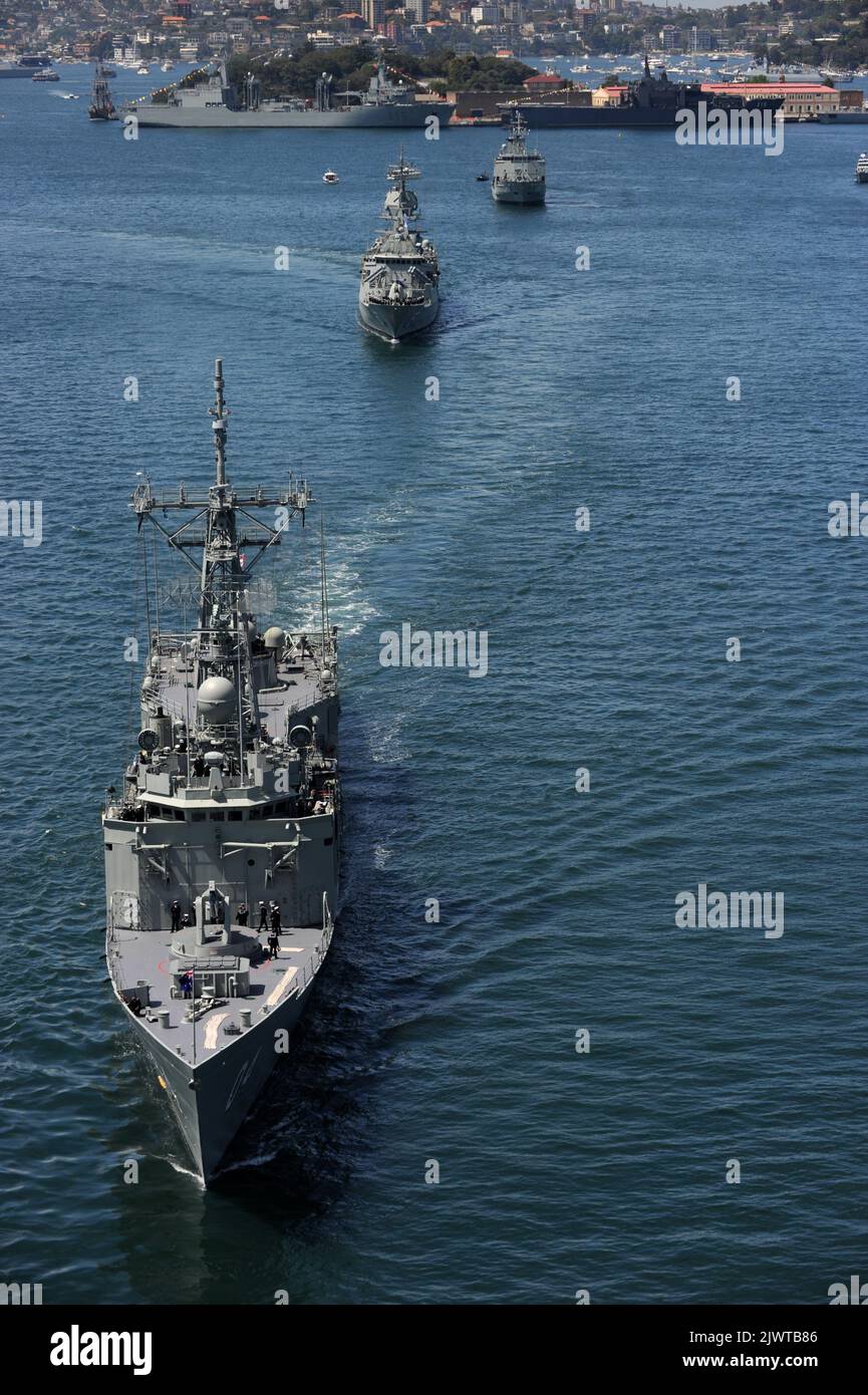 The Royal Australian Navy fleet make their way along Sydney Harbour ...