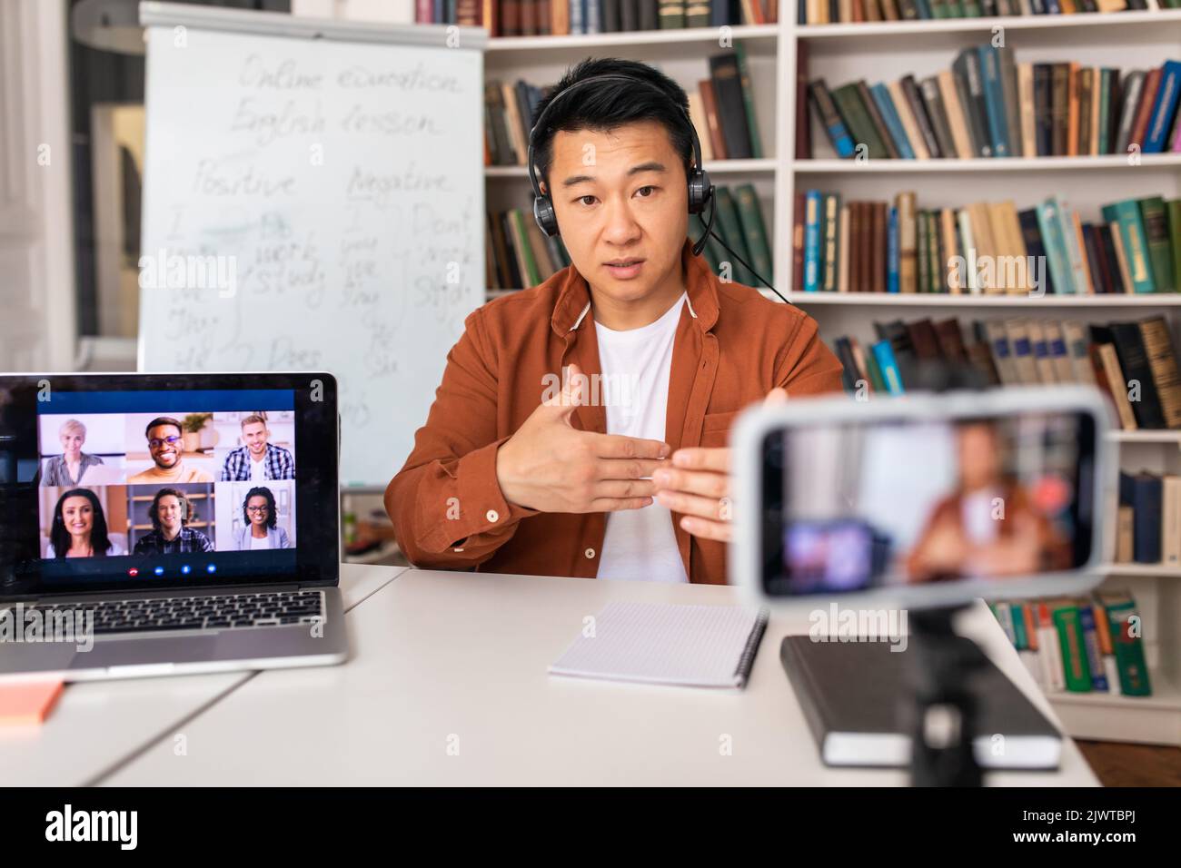 Asian Teacher Man Filming Lecture Teaching Online Sitting At Workplace ...