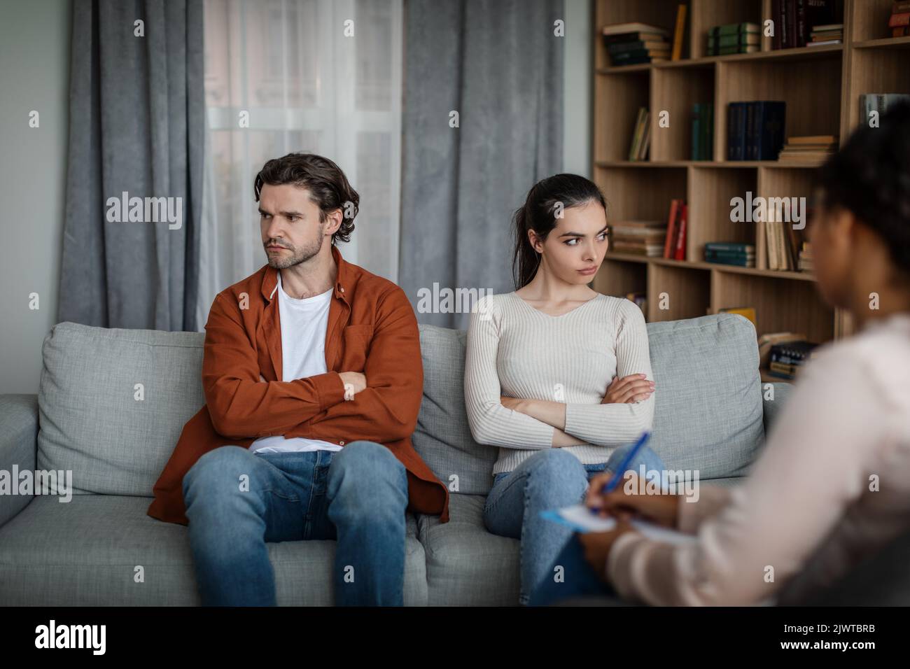 Angry millennial caucasian woman ignores man on consultation with ...