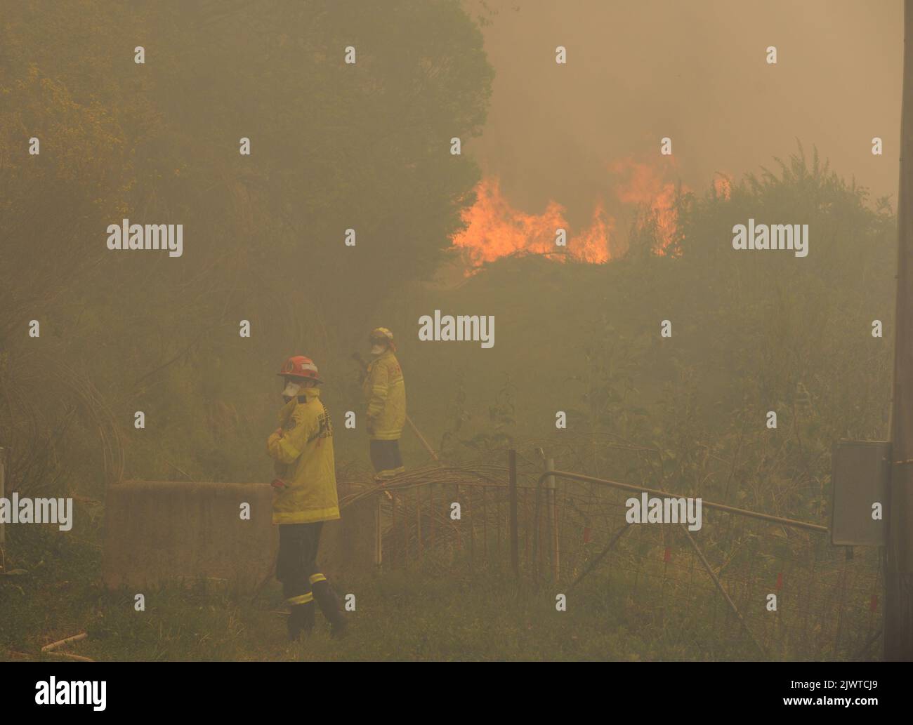 Fire and Rescue NSW officers in property protection mode at a bushfire ...