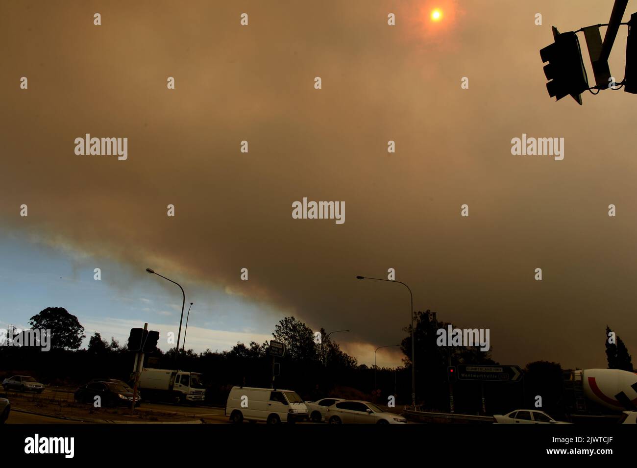 Thick smoke from a bushfire burning near Lithgow is seen at ...