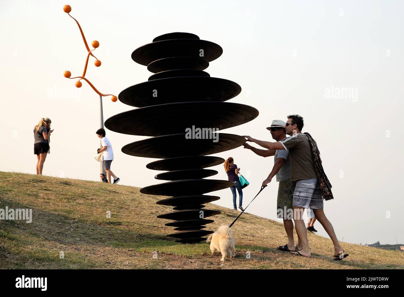 New Zealand artist Phil Price's sculpture, 'Snake' (L), and Australian ...