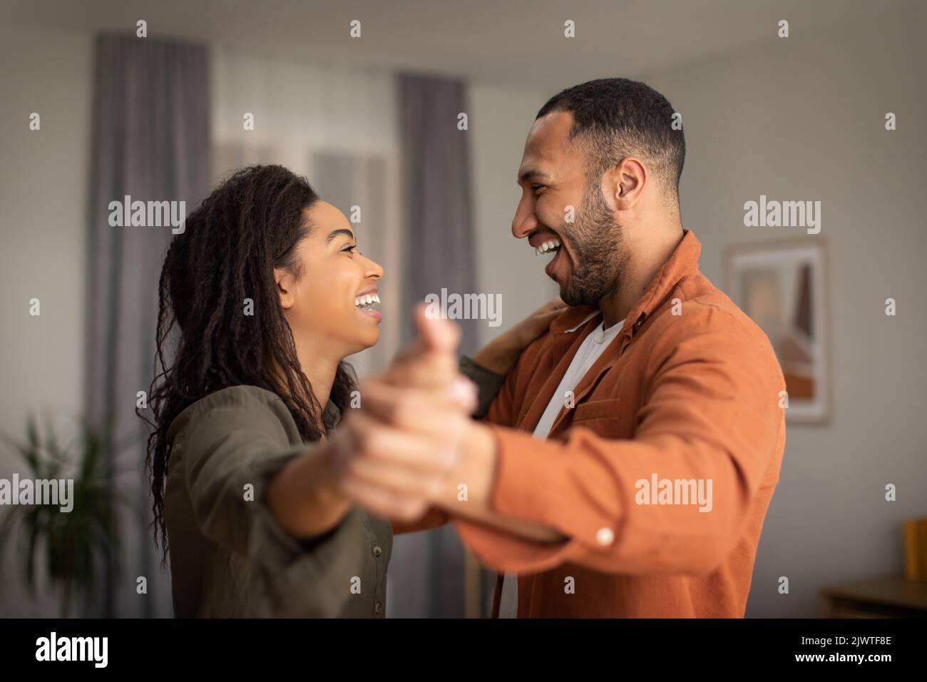 Happy Dating Black Couple Dancing Having Fun Together At Home Stock ...