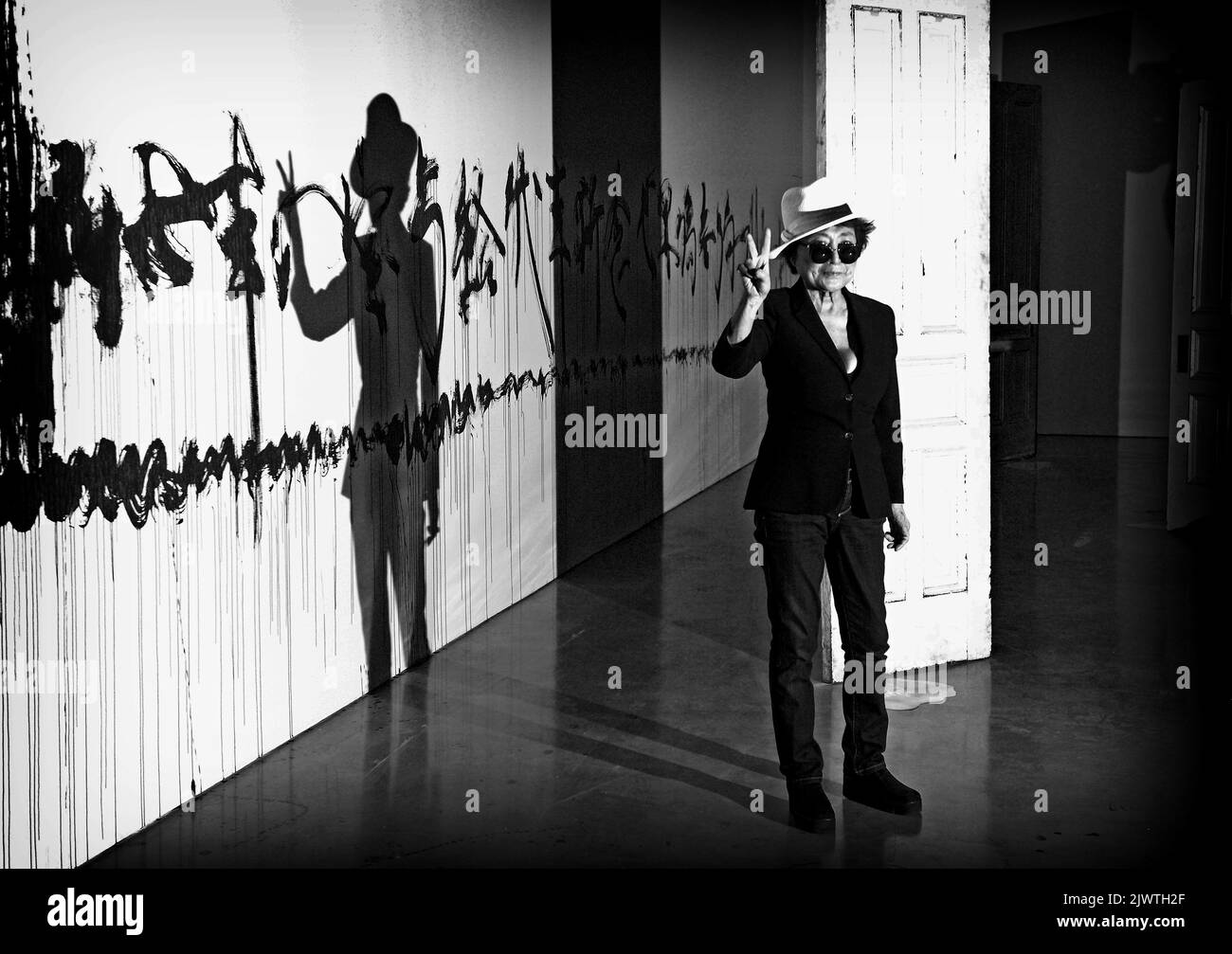 Yoko Ono poses for a photograph at the launch of her art exhibition ...