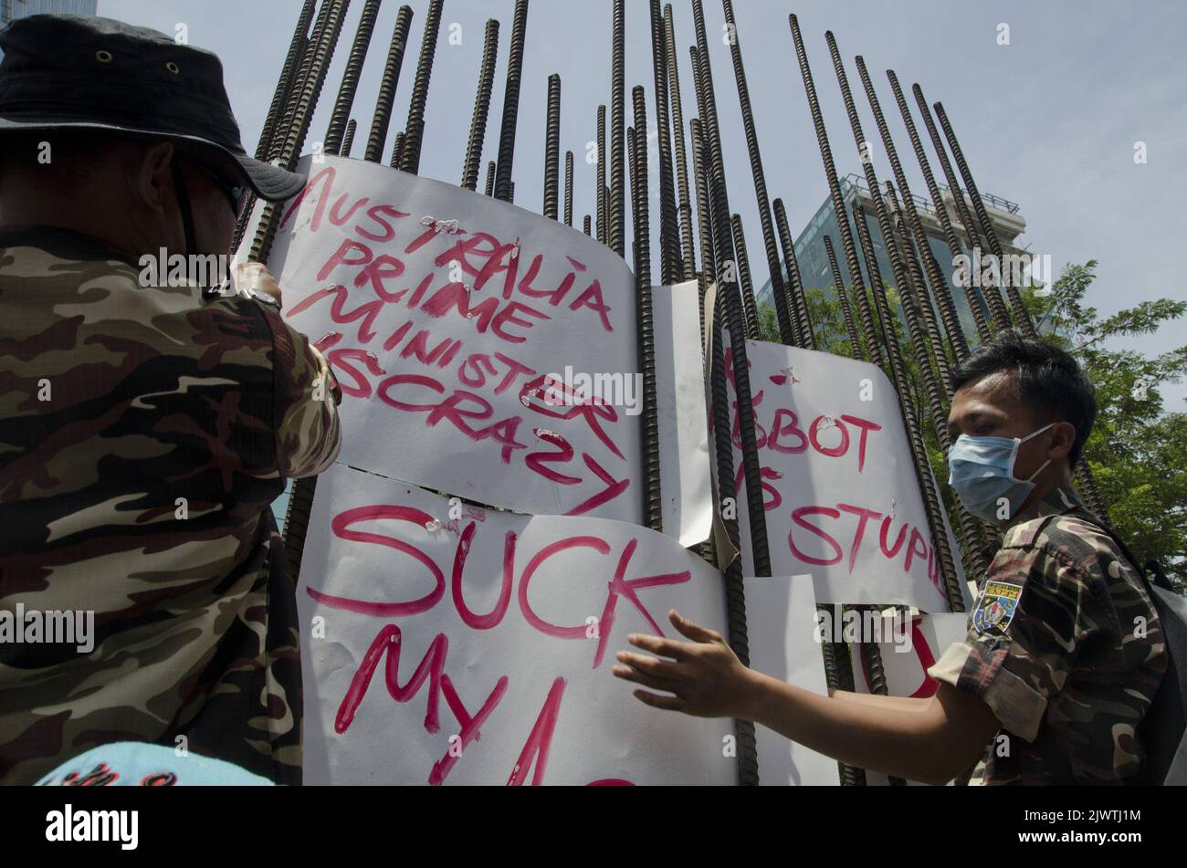 Protesters rally and placing posters "Australia Prime Minister is Crazy ...