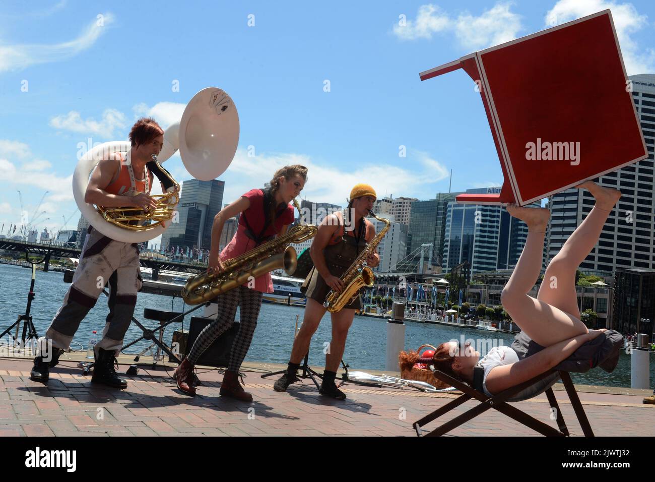 Circus Oz performer Hazel Bock foot juggling a table with fellow ...