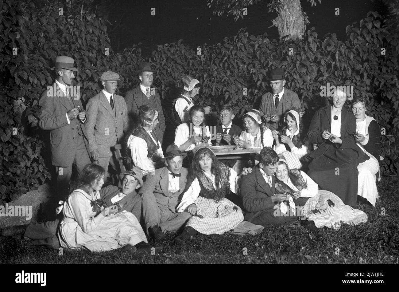 A midsummer night in "Erik-Lars" garden, the girls have flowers in ...