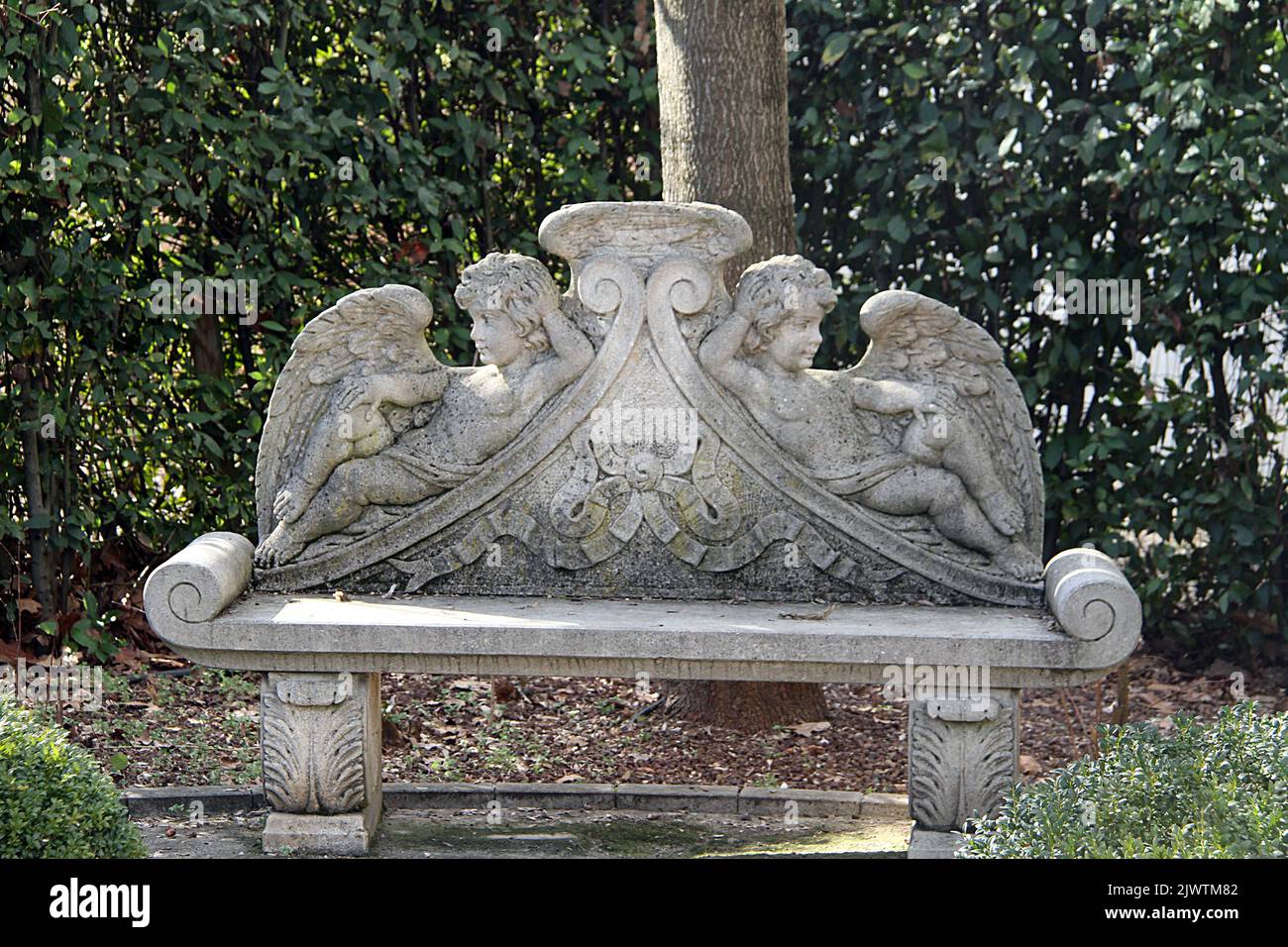 Bench decorated with angel figures in Italy Stock Photo - Alamy