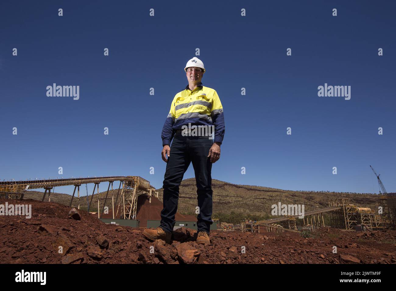FMG CEO Nev Power stands on an embankment at Kings Ore Processing ...
