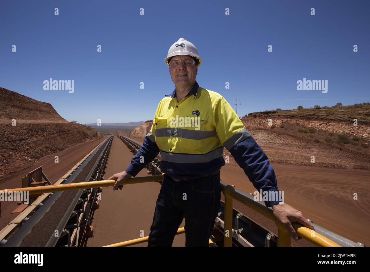 FMG CEO Nev Power stands above Firetail and Kings conveyor during the ...