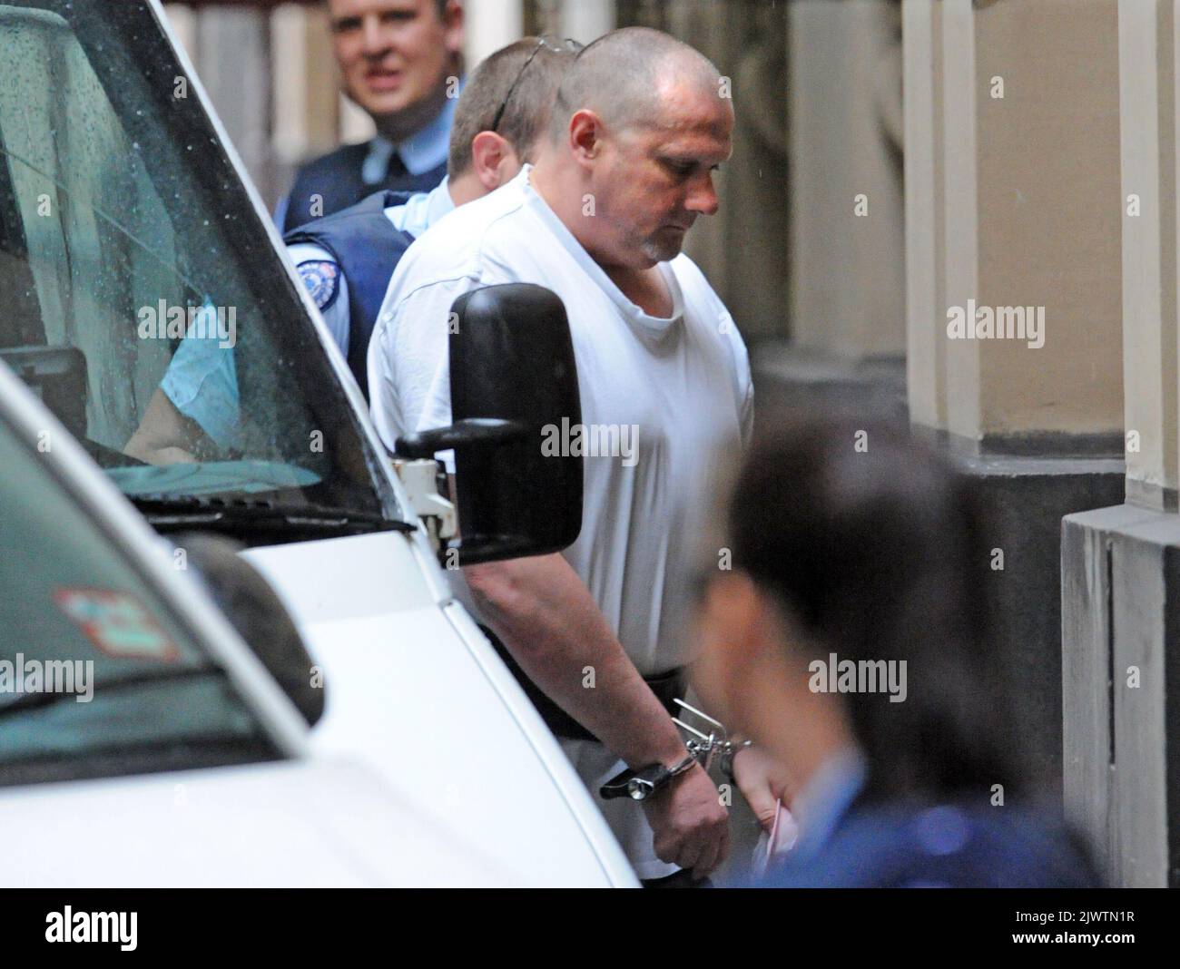 Leslie Alfred Camilleri is lead into the Supreme Court in Melbourne ...