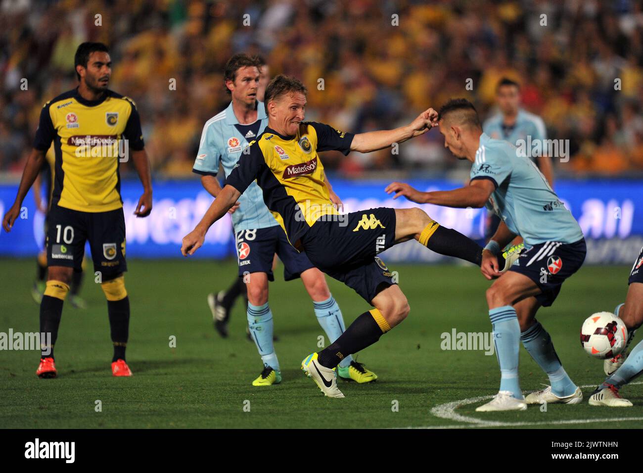 The Central Coast Mariners' Daniel McBreen (centre) takes a shot at ...