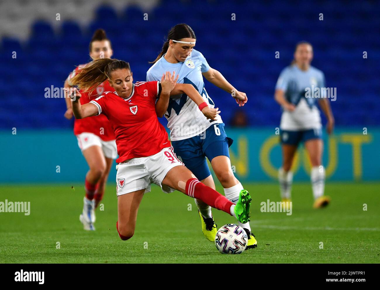 Wales' Kayleigh Green slides in on Slovenia's Kaja Korosec during the ...