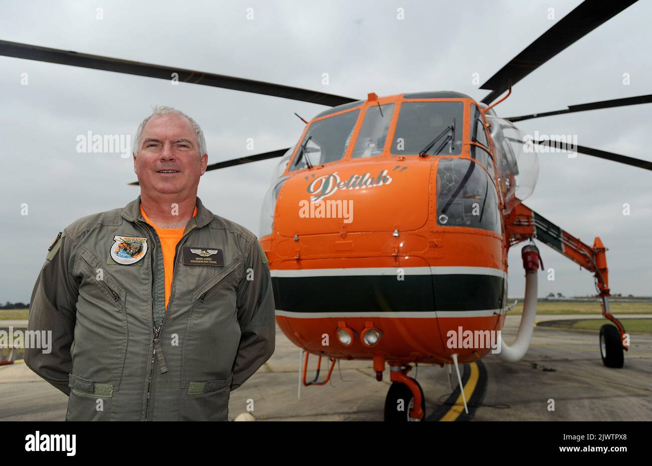 Australian pilot Mark Jones next to the aircrane helicopter that he ...