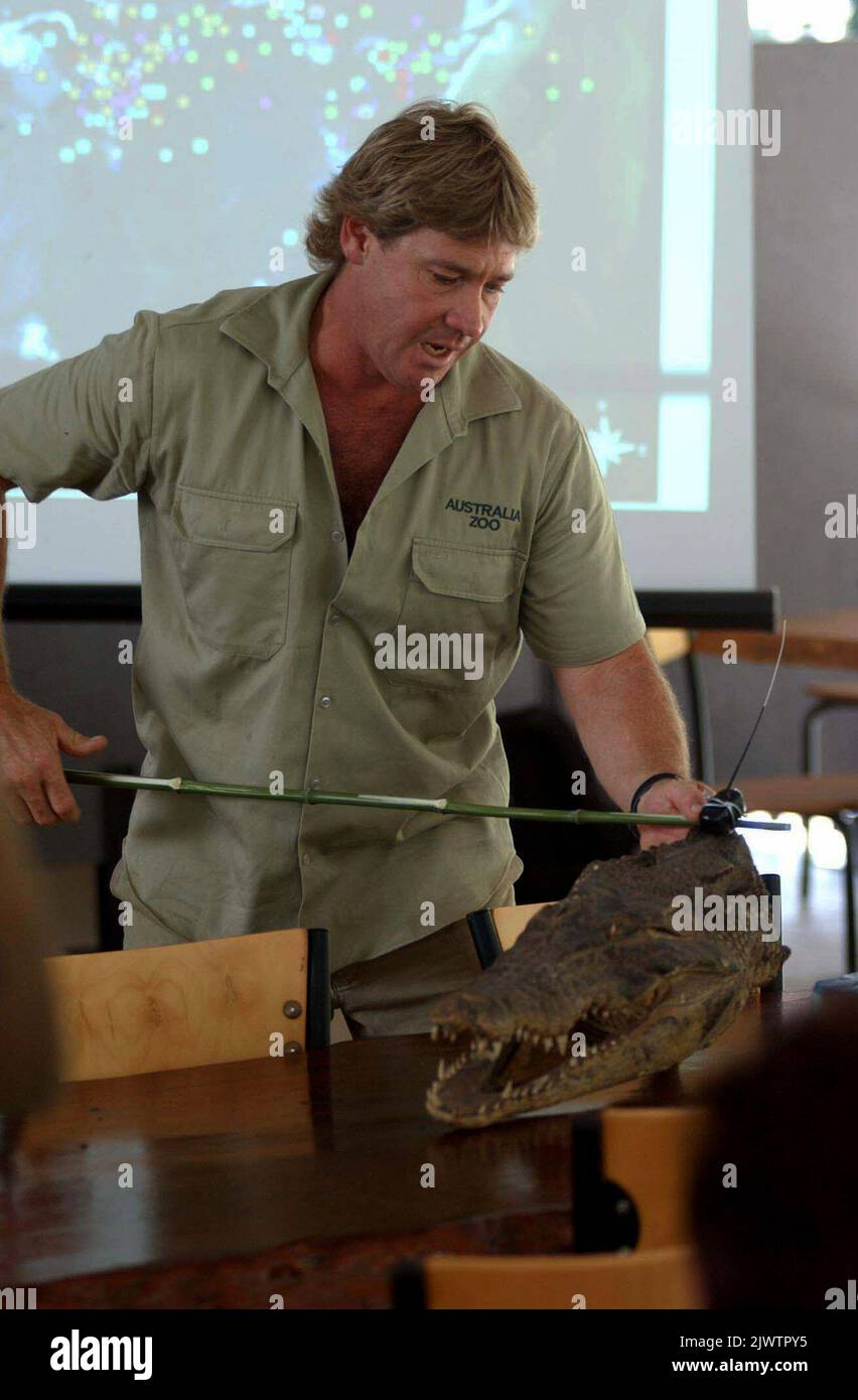 Steve Irwin known as "The Crocodile Hunter" demonstrates placement of a ...