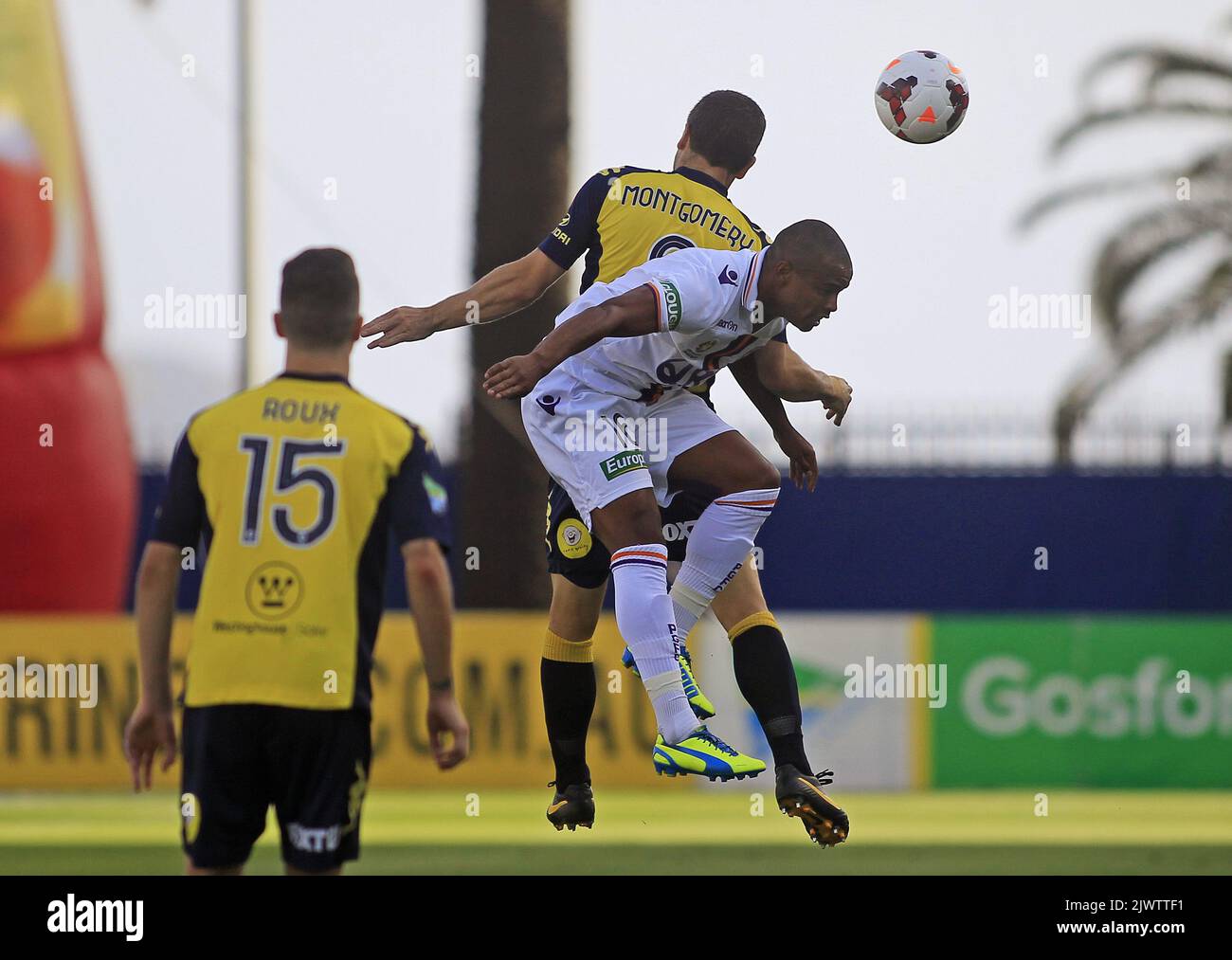 Mariners Nick Montgomery and Glory Sidnei Sciola Moraes during the Round 12 A-League match ...
