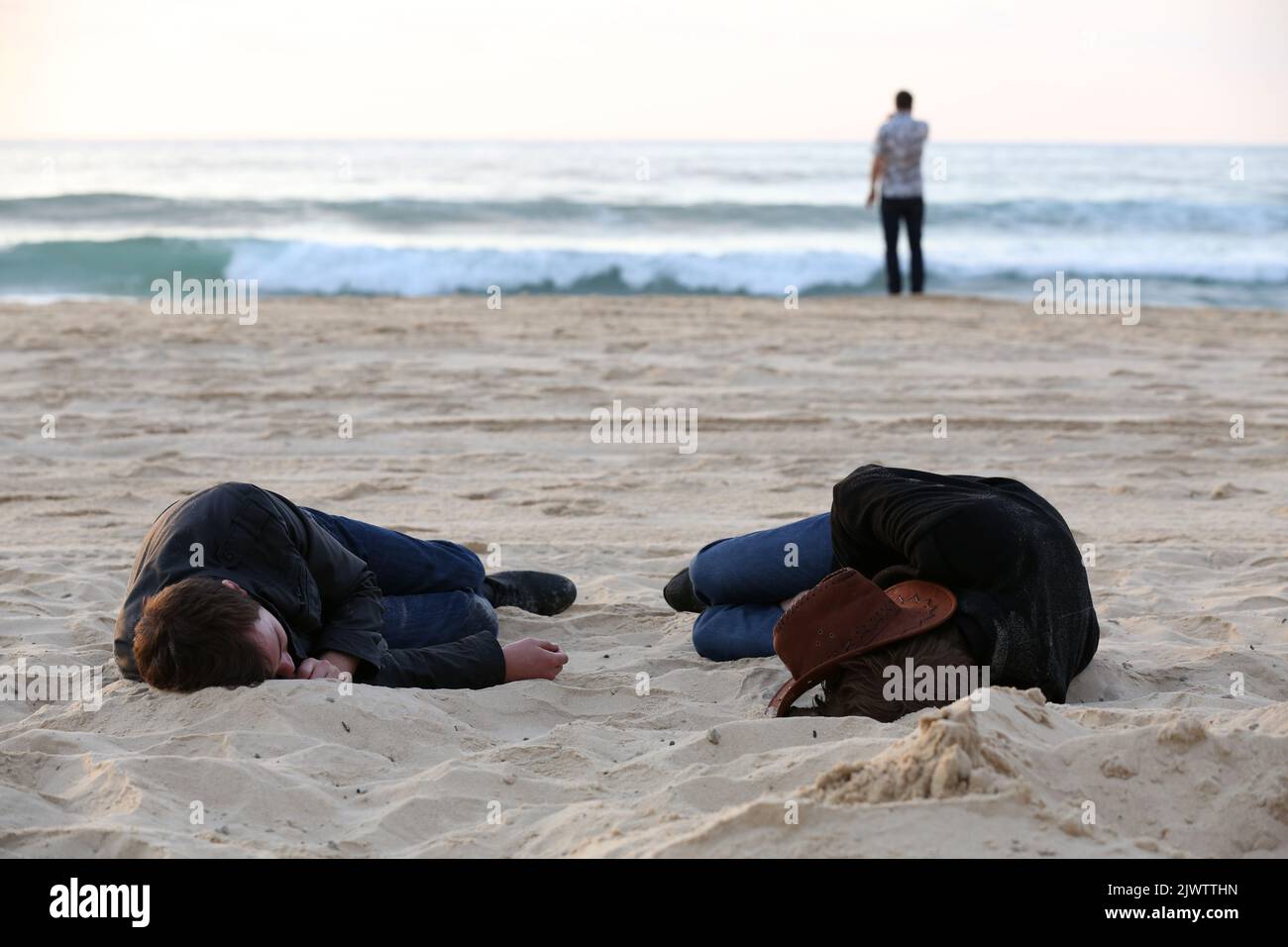 New Year's Eve revellers on Bondi Beach at sunrise in Sydney, Wednesday ...