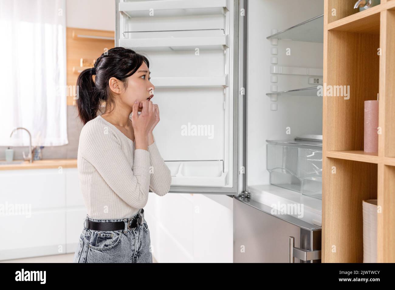Shocked unhappy asian young hi-res stock photography and images - Alamy