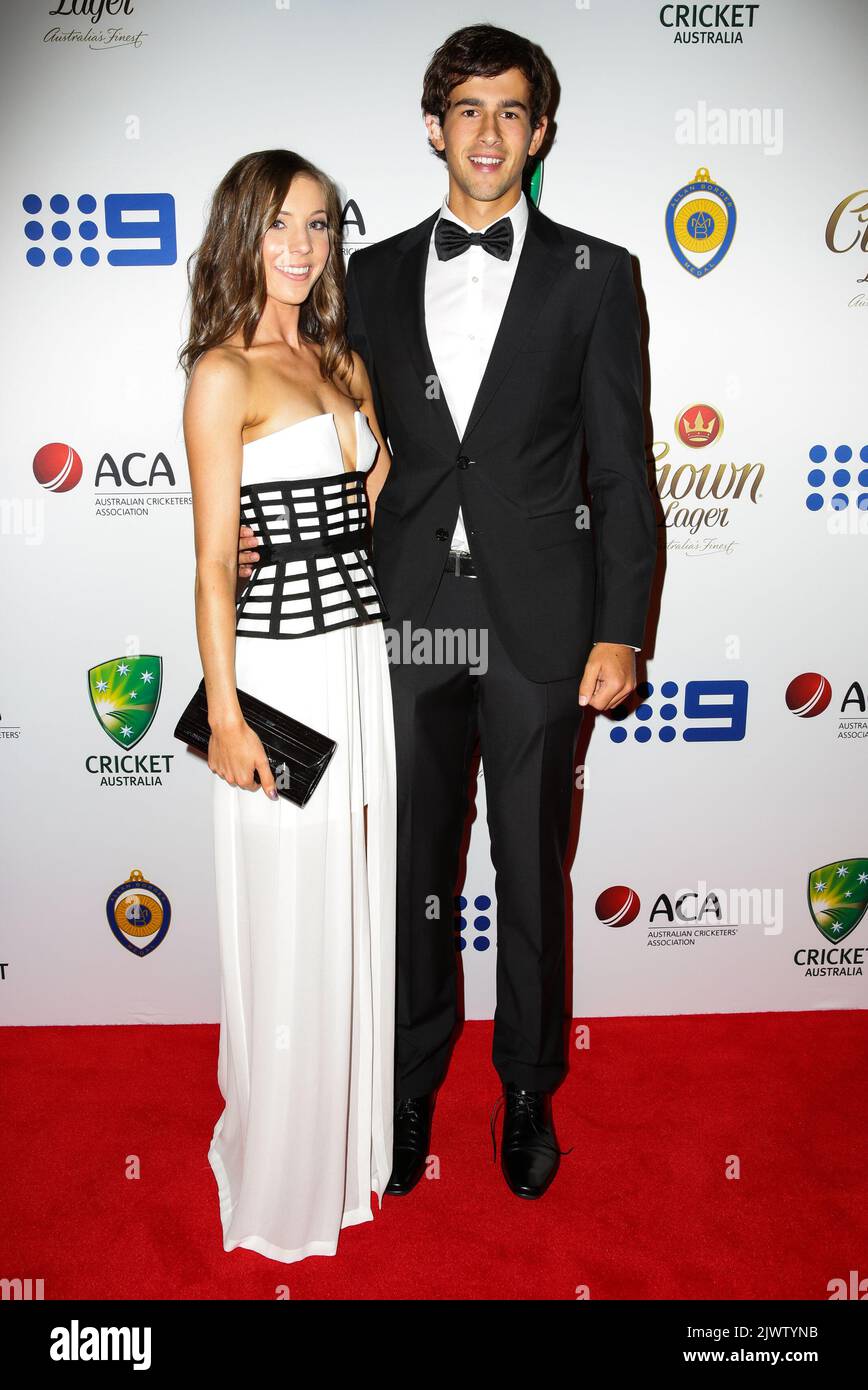 Ashton Aagar and Madeline Hay pose on the red carpet at the 2014 Allan ...