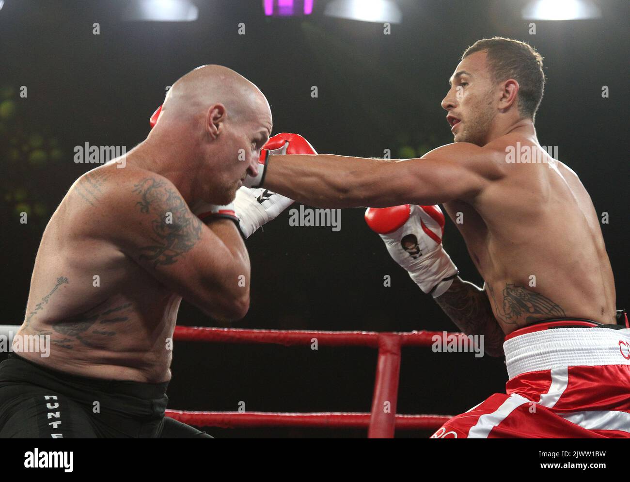 Quade Cooper, R, and Warren Tresidder during their cruiserweight bout ...