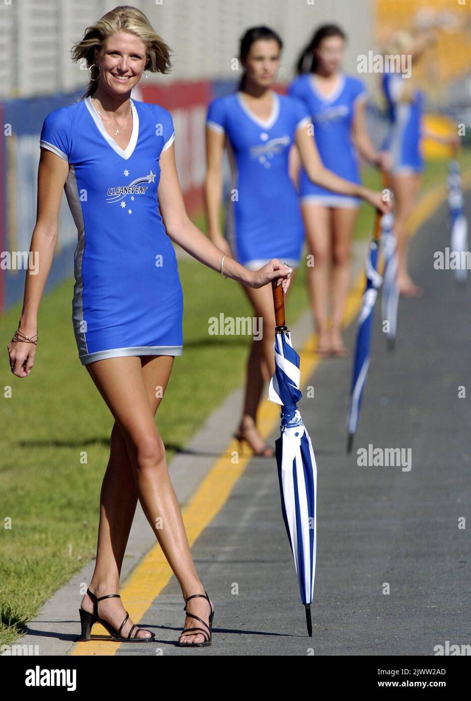 Grid girls line up on the Albert Park Street circuit in a preliminary ...