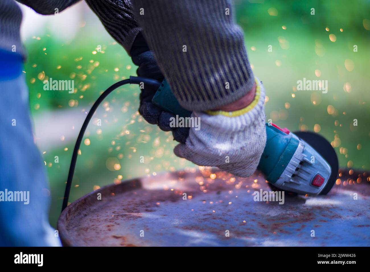 Man working with grinder saw, close up view on tool. Electric saw and ...