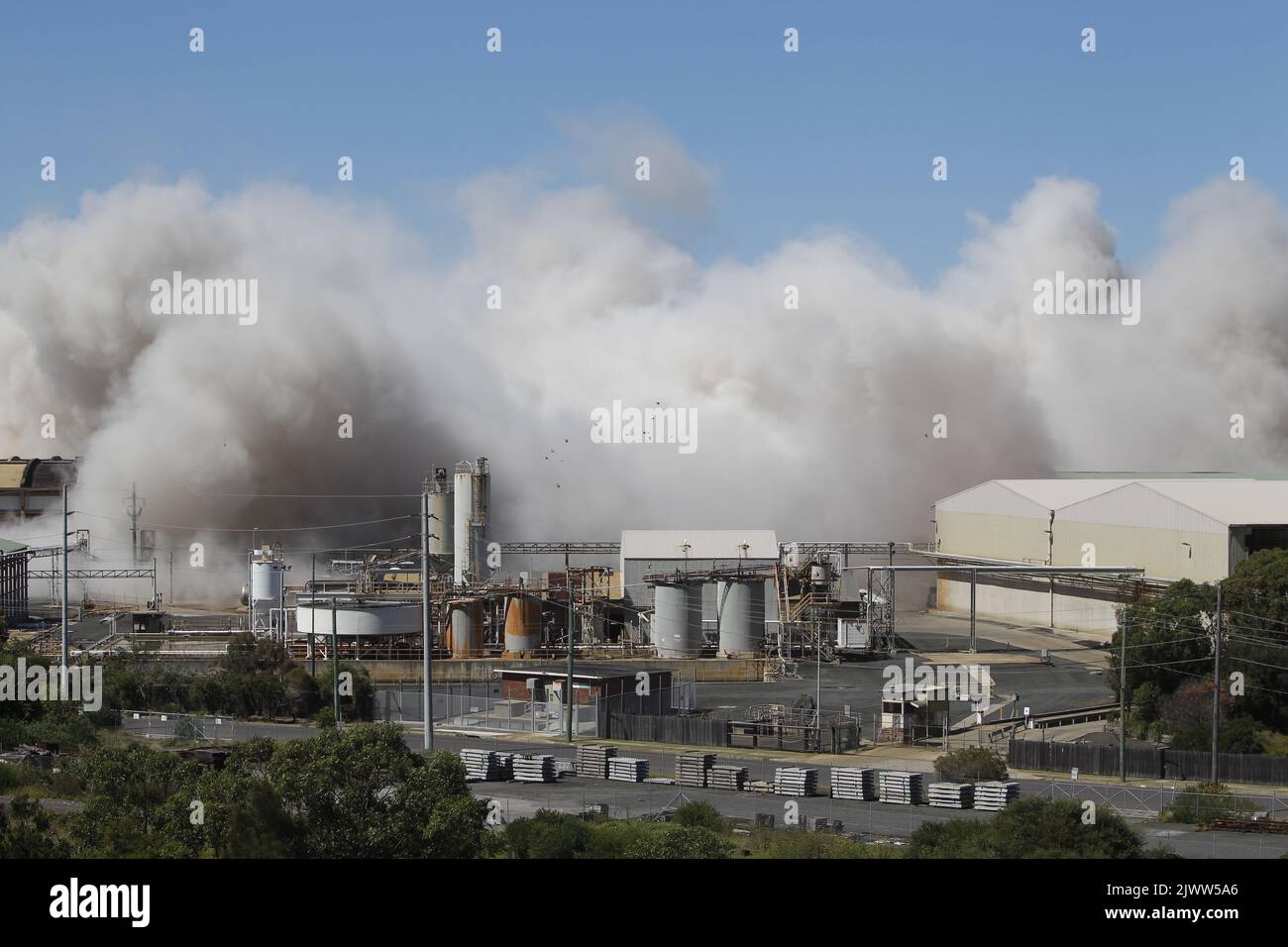 The historic Port Kembla Copper Refinery Stack collapses, Thursday,Feb ...
