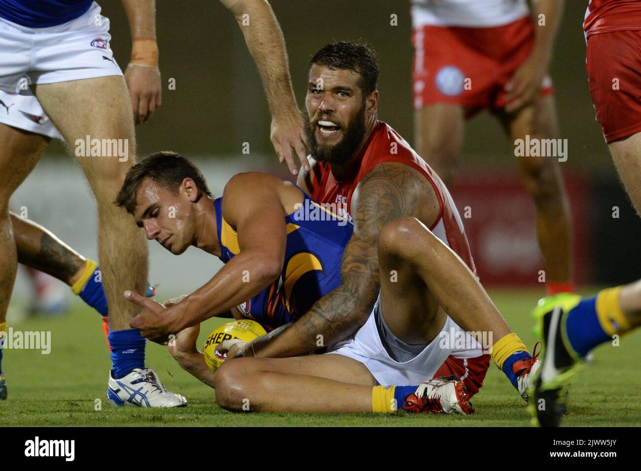 Swan's Buddy Franklin tackles West Coast's Dom Sheed during the Round ...