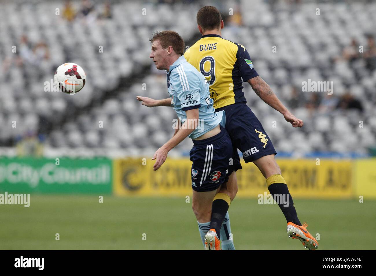 Aaron Calver, (Sydney FC), wins the ball from Mitchell Duke during ...