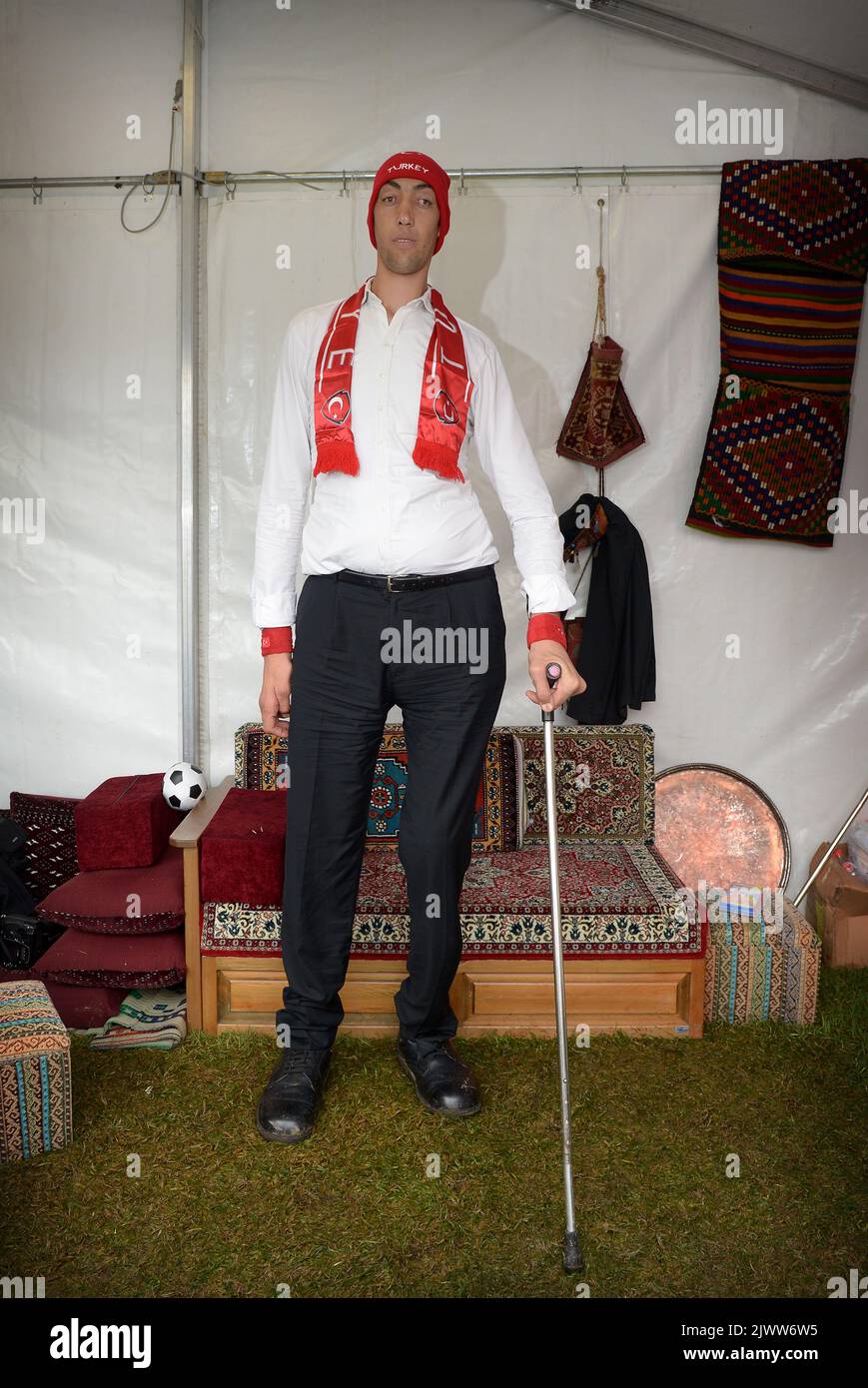 The world's tallest person Sultan Kosen, from Turkey, poses for a photograph at the Anatolian ...