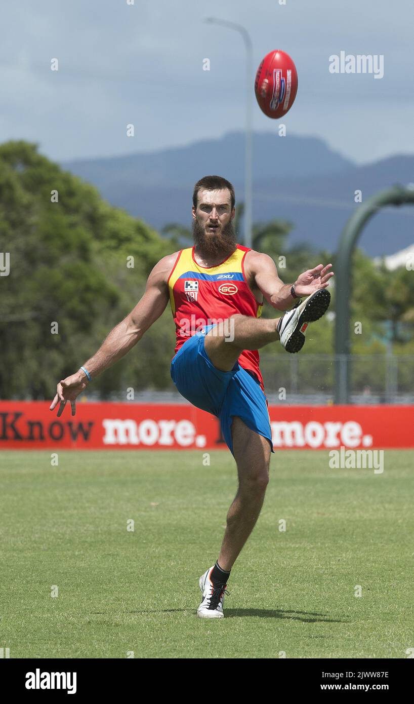Charlie Dixon kicks during the Gold Coast Suns training session on the ...