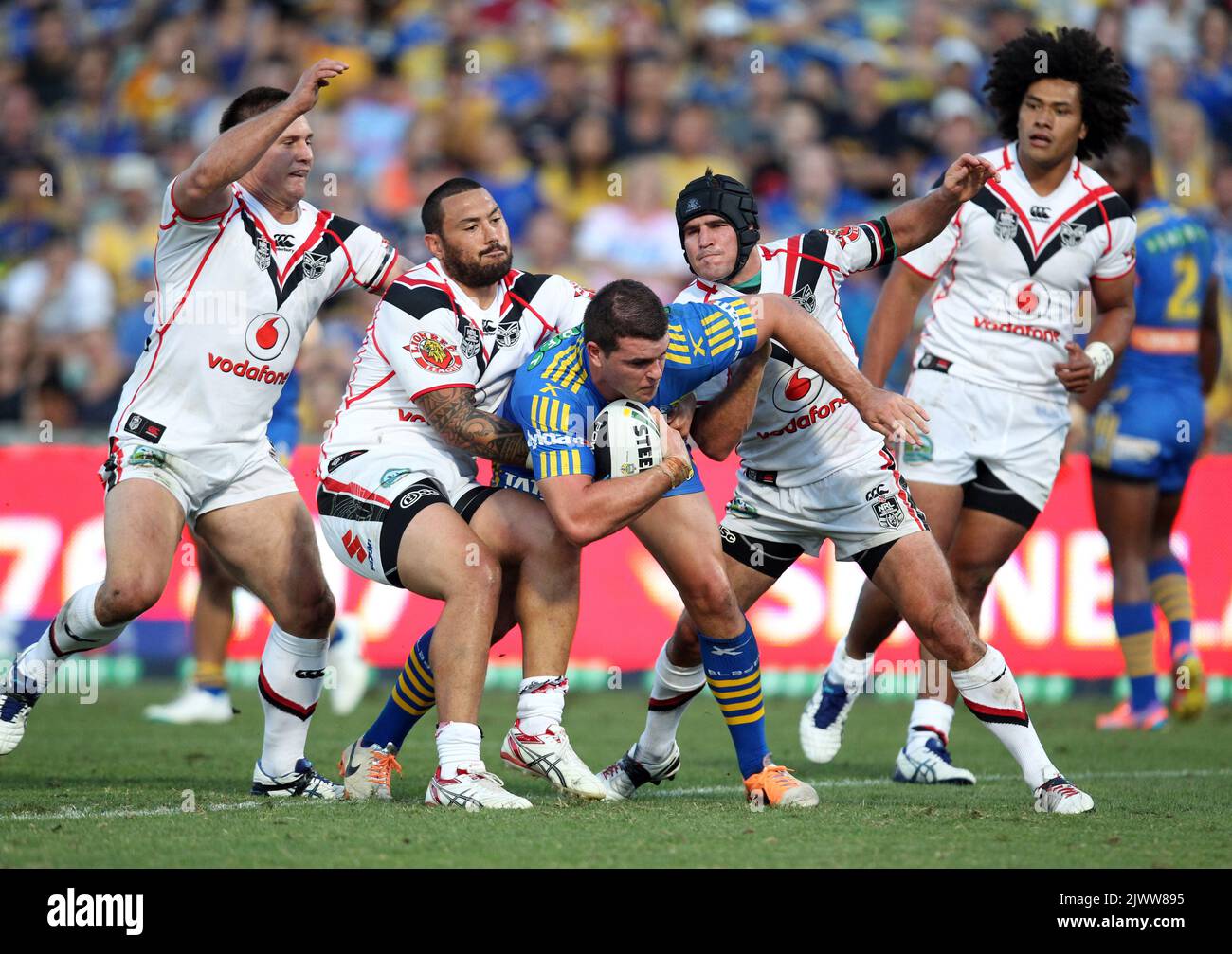 Darcy Lussick surrounded by Warriors during the NRL Rugby League Round ...
