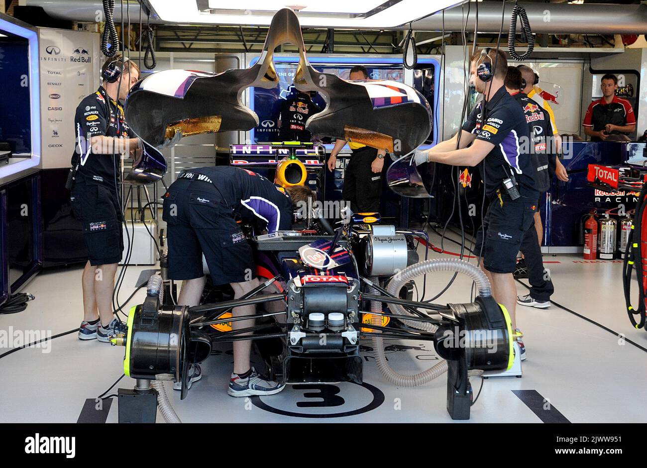 Mechanics assemble Australian Formula 1 driver Daniel Ricciardo's car ...