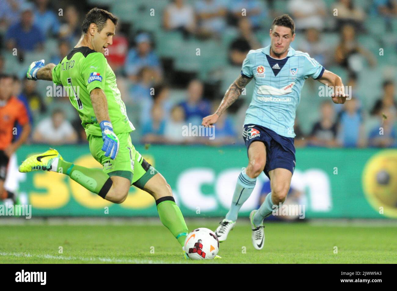 Brisbane's goal keeper Michael Theo clears the ball as Sydney's Corey ...