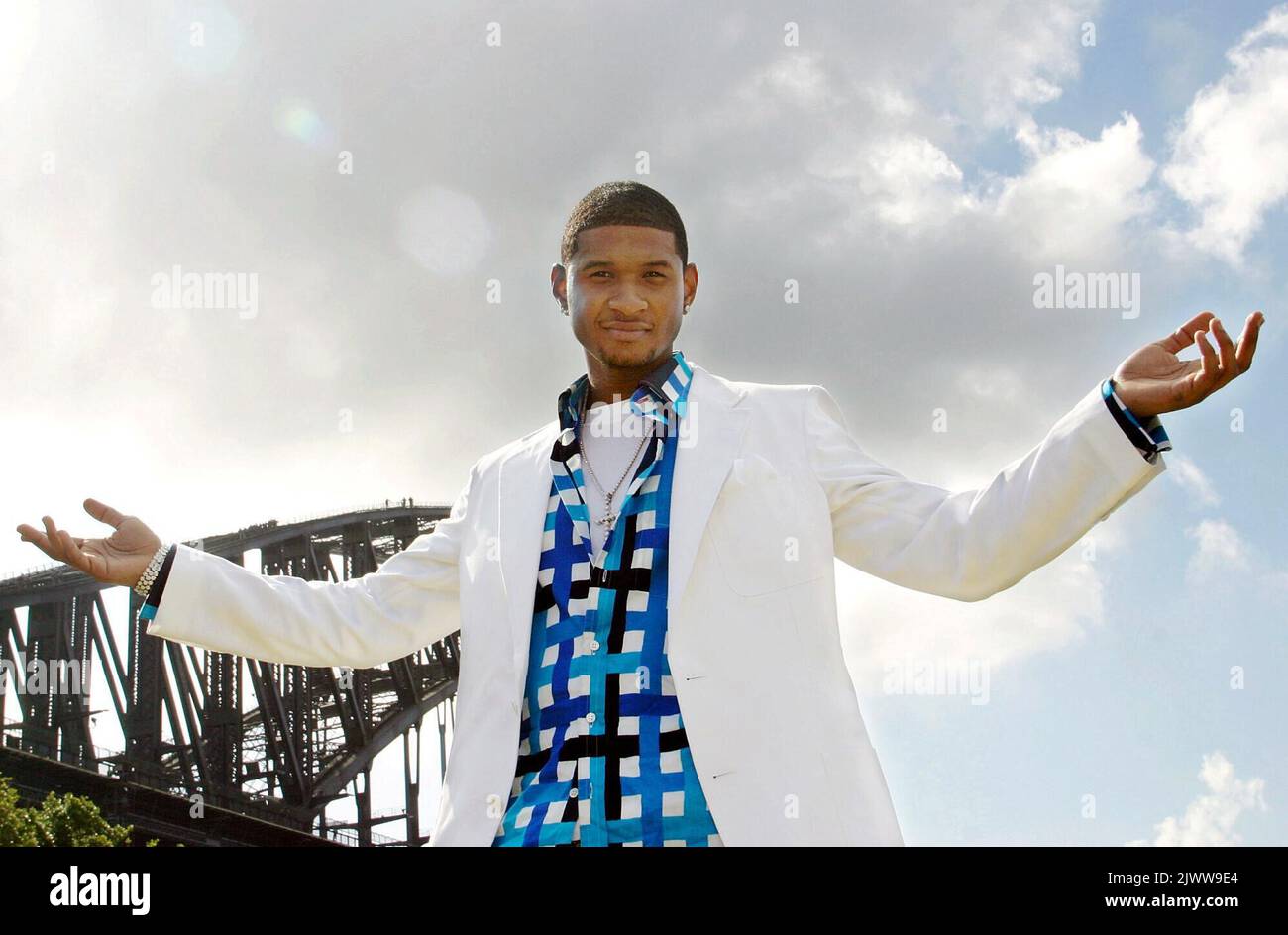 American singer, Usher, poses for photographs in front of the Harbour ...