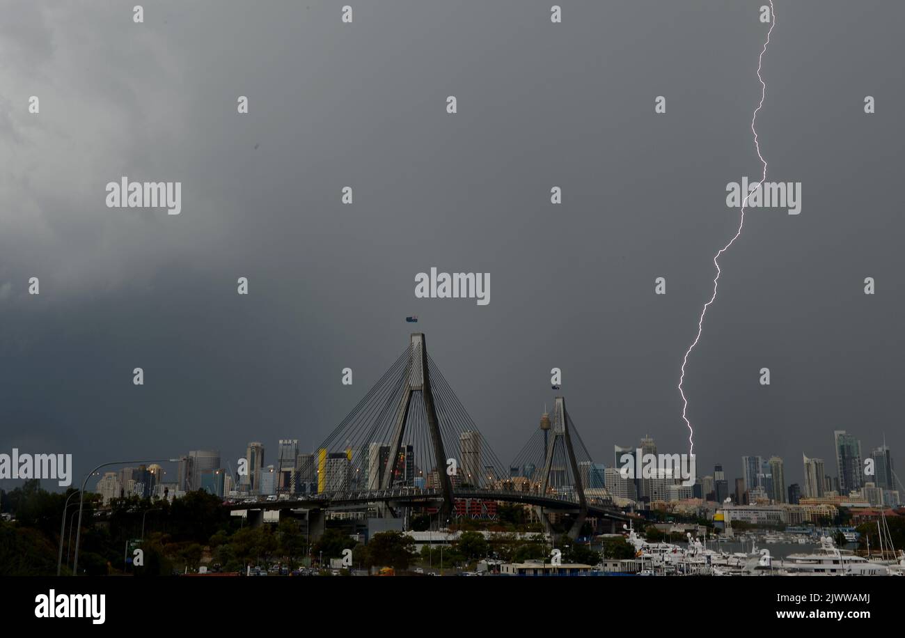 Lightning is seen as a thunderstorm passes over at Sydney on Wednesday ...