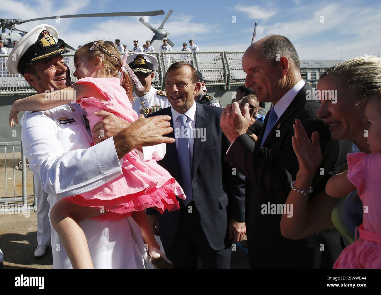 Prime Minister Tony Abbott looks on as the Captain of the HMAS ...